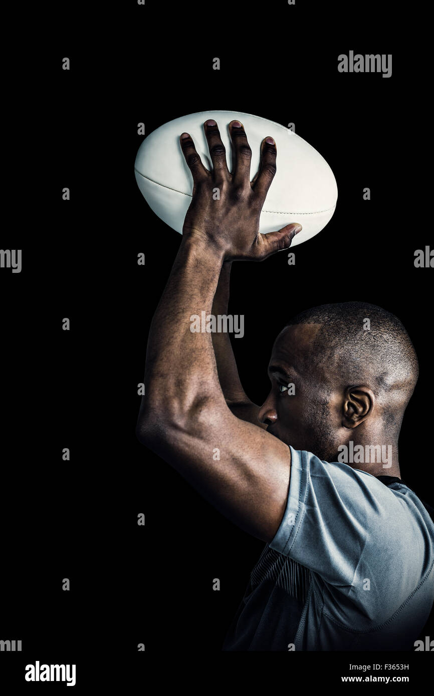 Composite image of rugby player throwing ball Stock Photo - Alamy