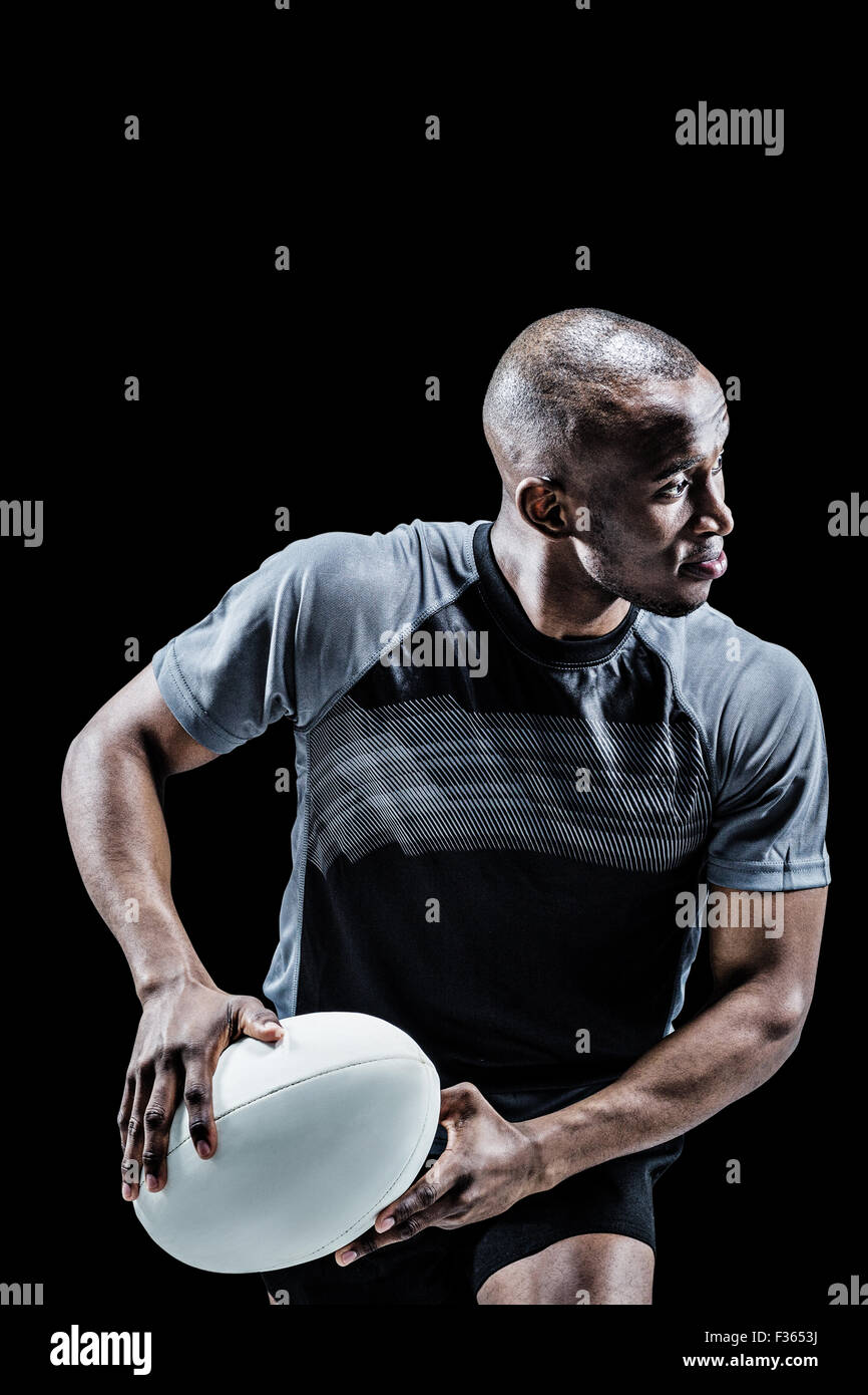 Composite image of athlete running with rugby ball Stock Photo - Alamy