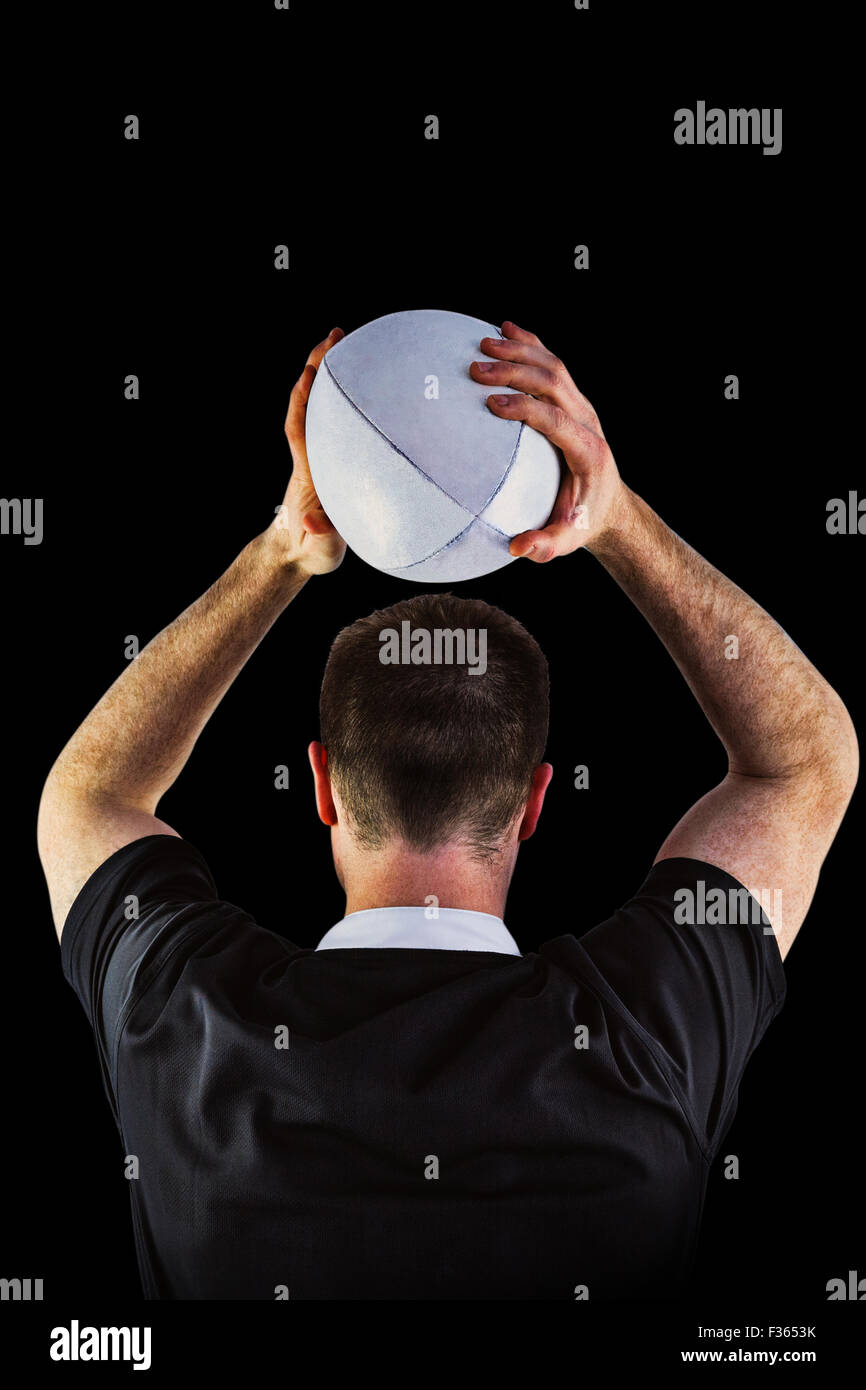 Composite image of rugby player about to throw a rugby ball Stock Photo ...