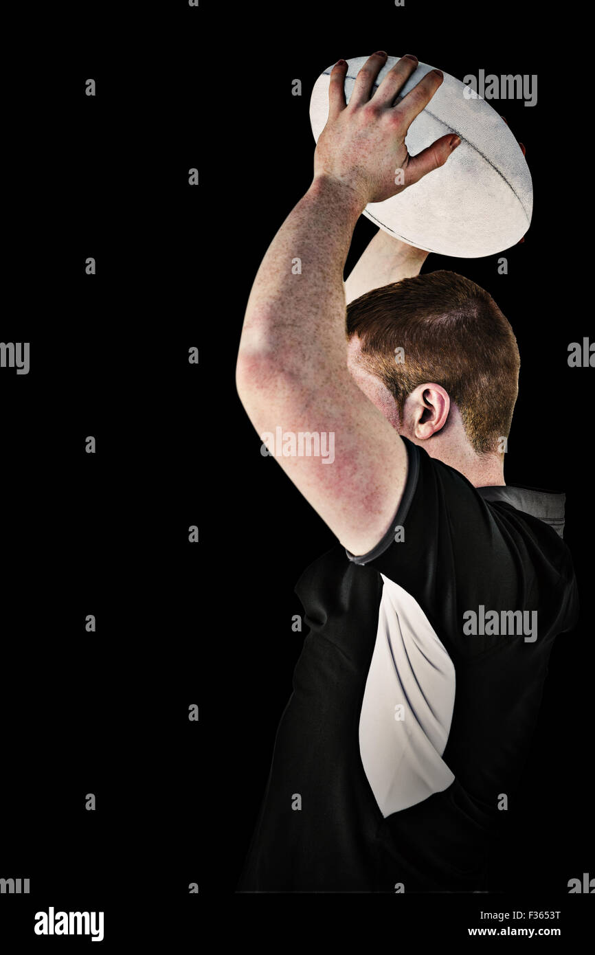 Composite image of rugby player about to throw a rugby ball Stock Photo ...