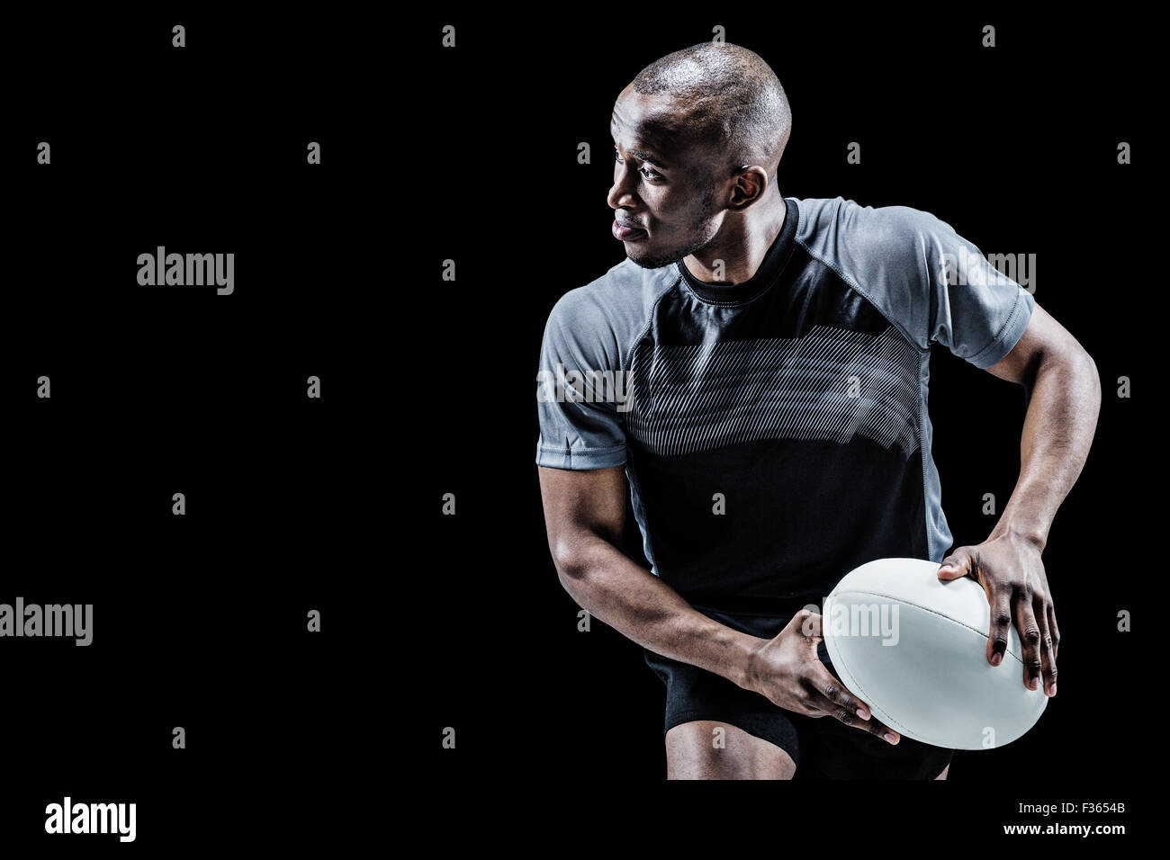 Composite image of athlete running with rugby ball Stock Photo - Alamy