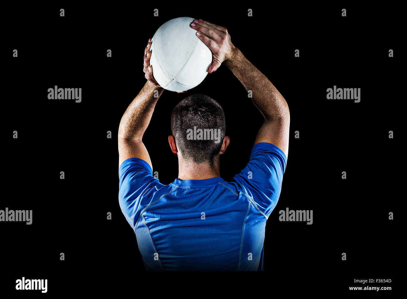 Composite image of rear view of rugby player throwing ball Stock Photo ...