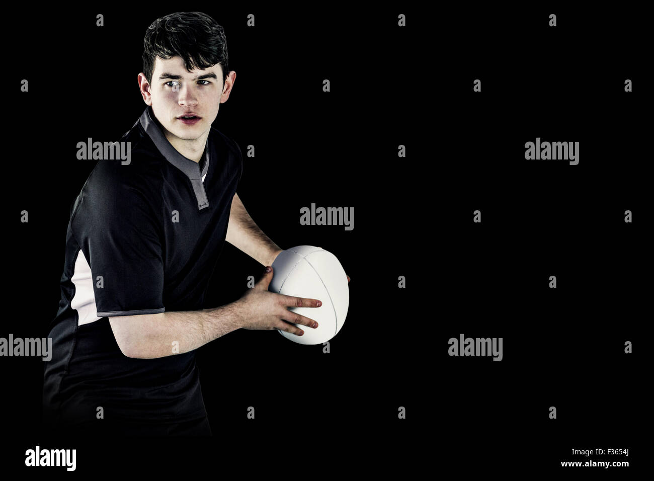 Composite image of rugby player about to throw a rugby ball Stock Photo ...