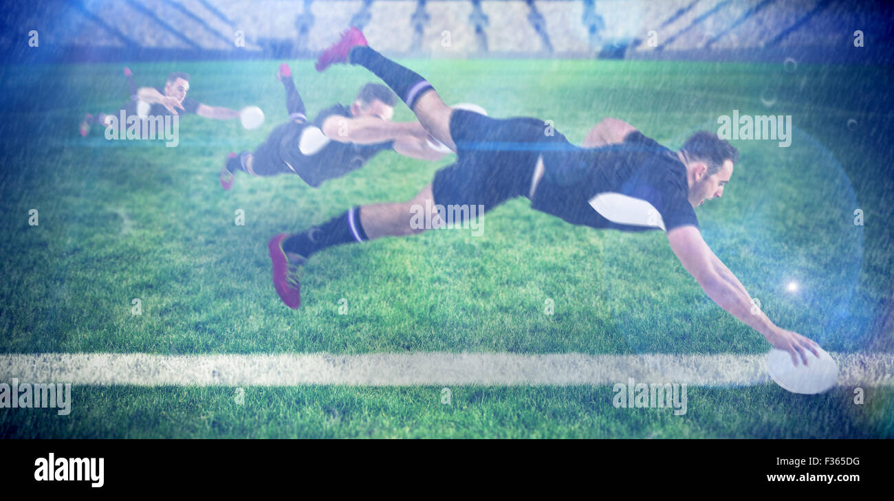 Composite image of rugby player scoring a try Stock Photo - Alamy