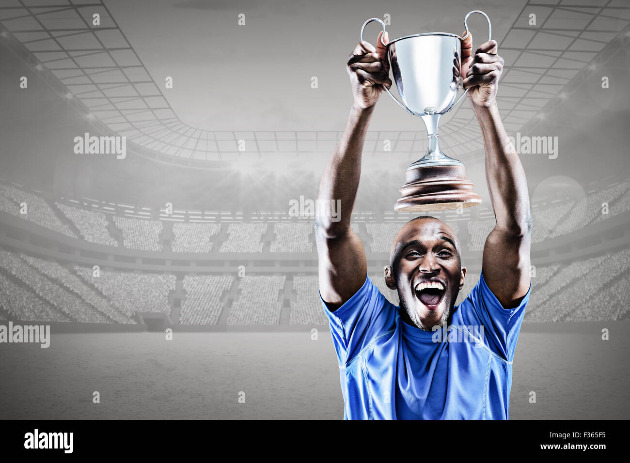 Composite image of happy athlete cheering while holding trophy Stock ...