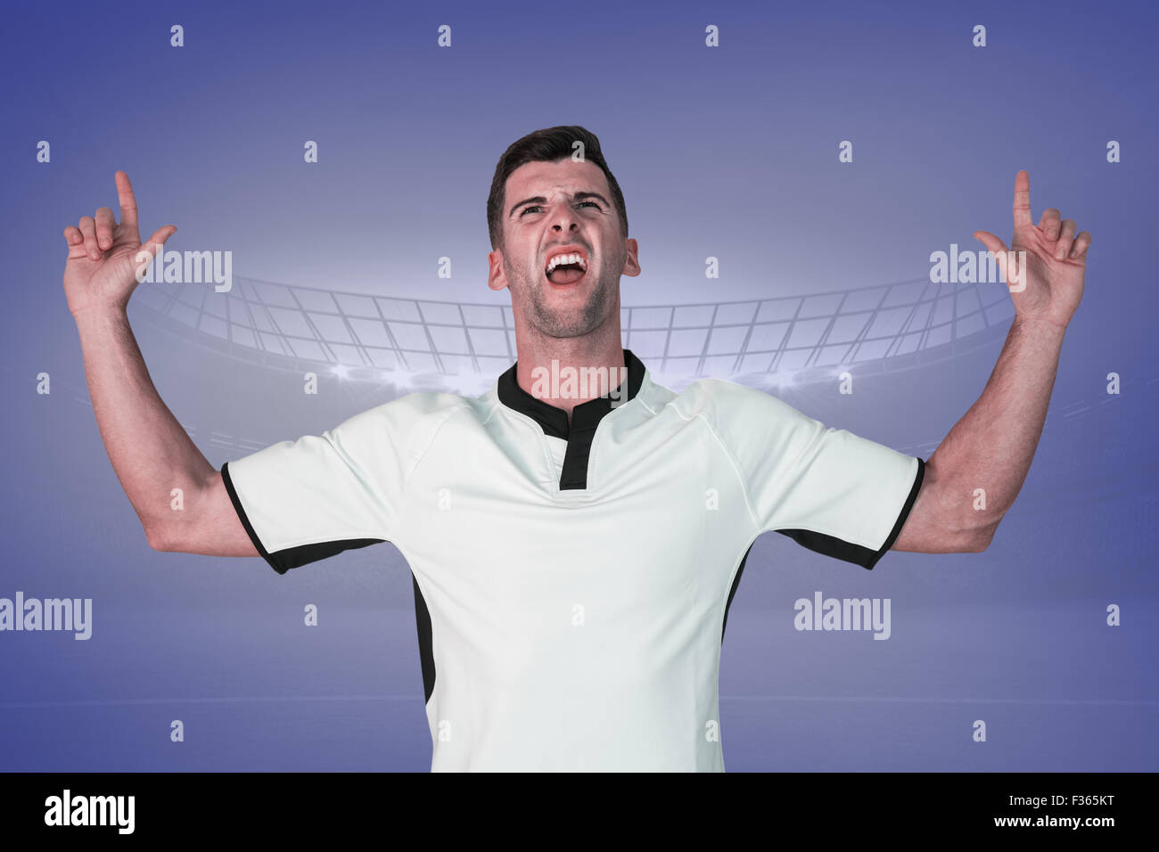 Composite image of excited rugby player pointing up Stock Photo - Alamy