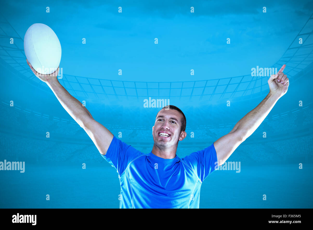 Composite image of happy rugby player in blue jersey holding ball with ...