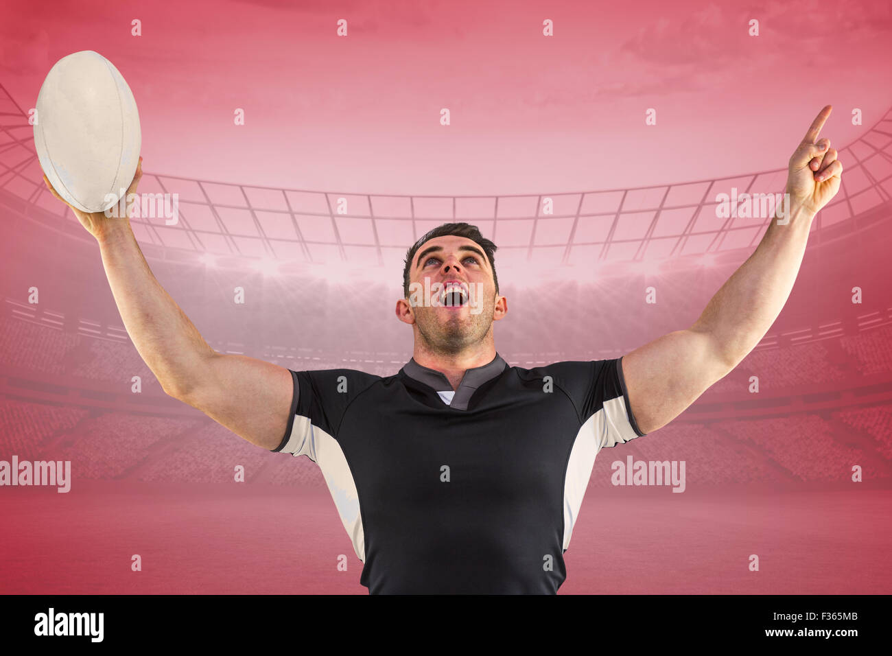Composite image of rugby player cheering with the ball Stock Photo - Alamy