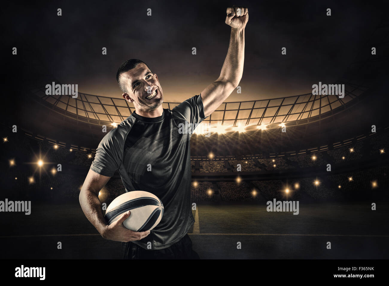 Composite image of happy rugby player punching the air Stock Photo - Alamy