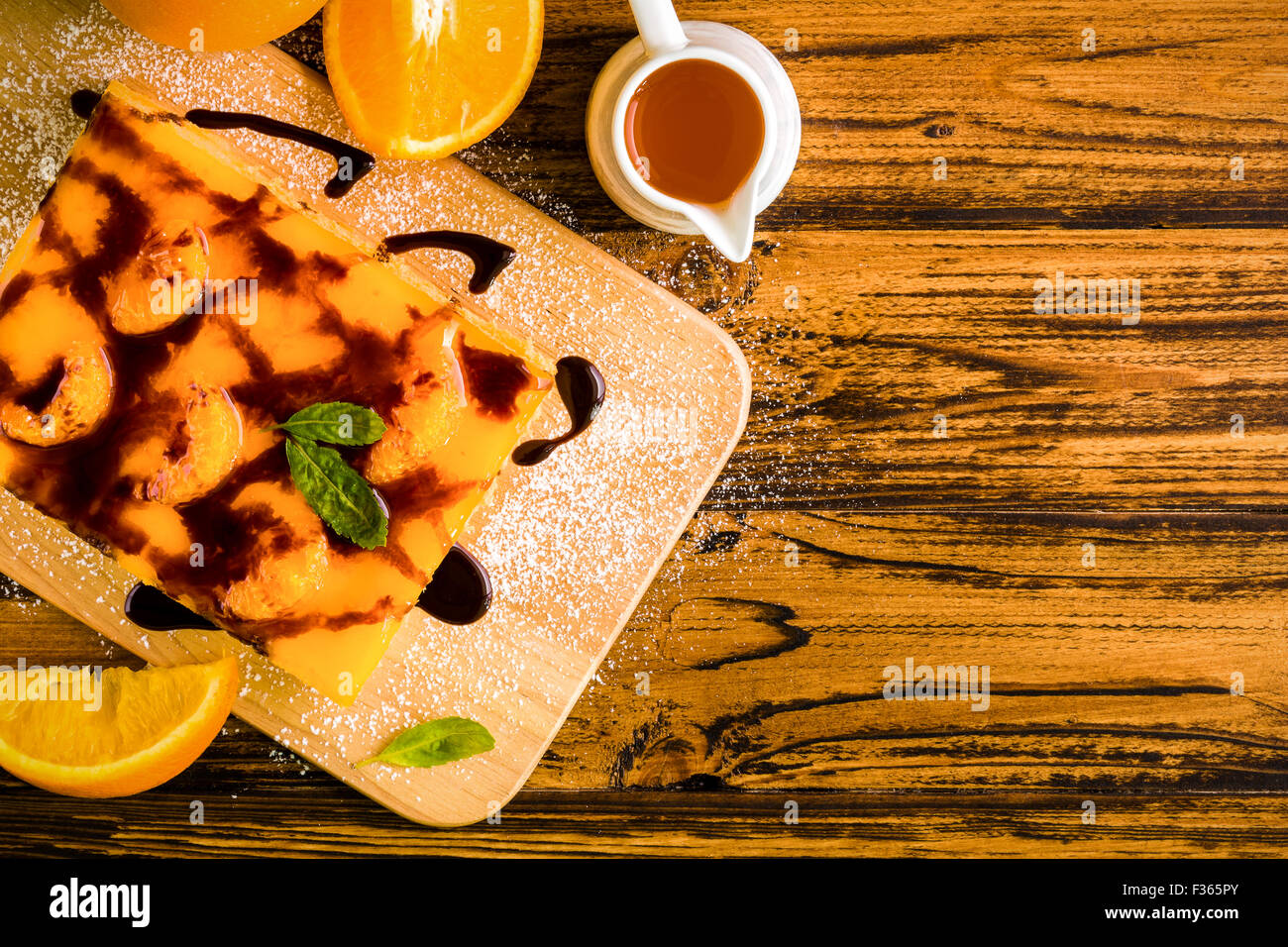 Orange cake with chocolate sauce for tea break Stock Photo - Alamy