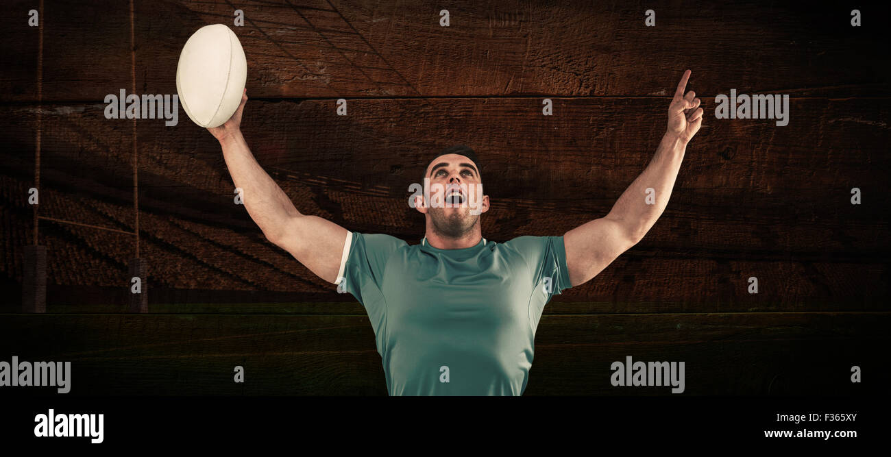 Composite image of rugby player cheering and pointing Stock Photo - Alamy