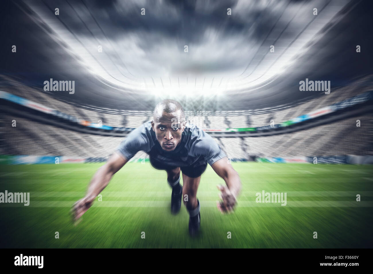 Composite image of portrait of rugby player jumping Stock Photo - Alamy