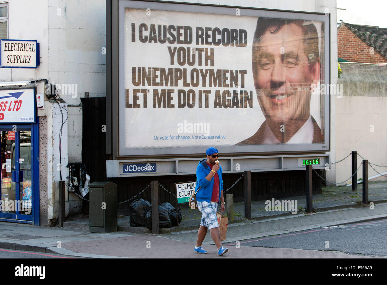 A Conservative Party billboard with Gordon Brown on residential street ...