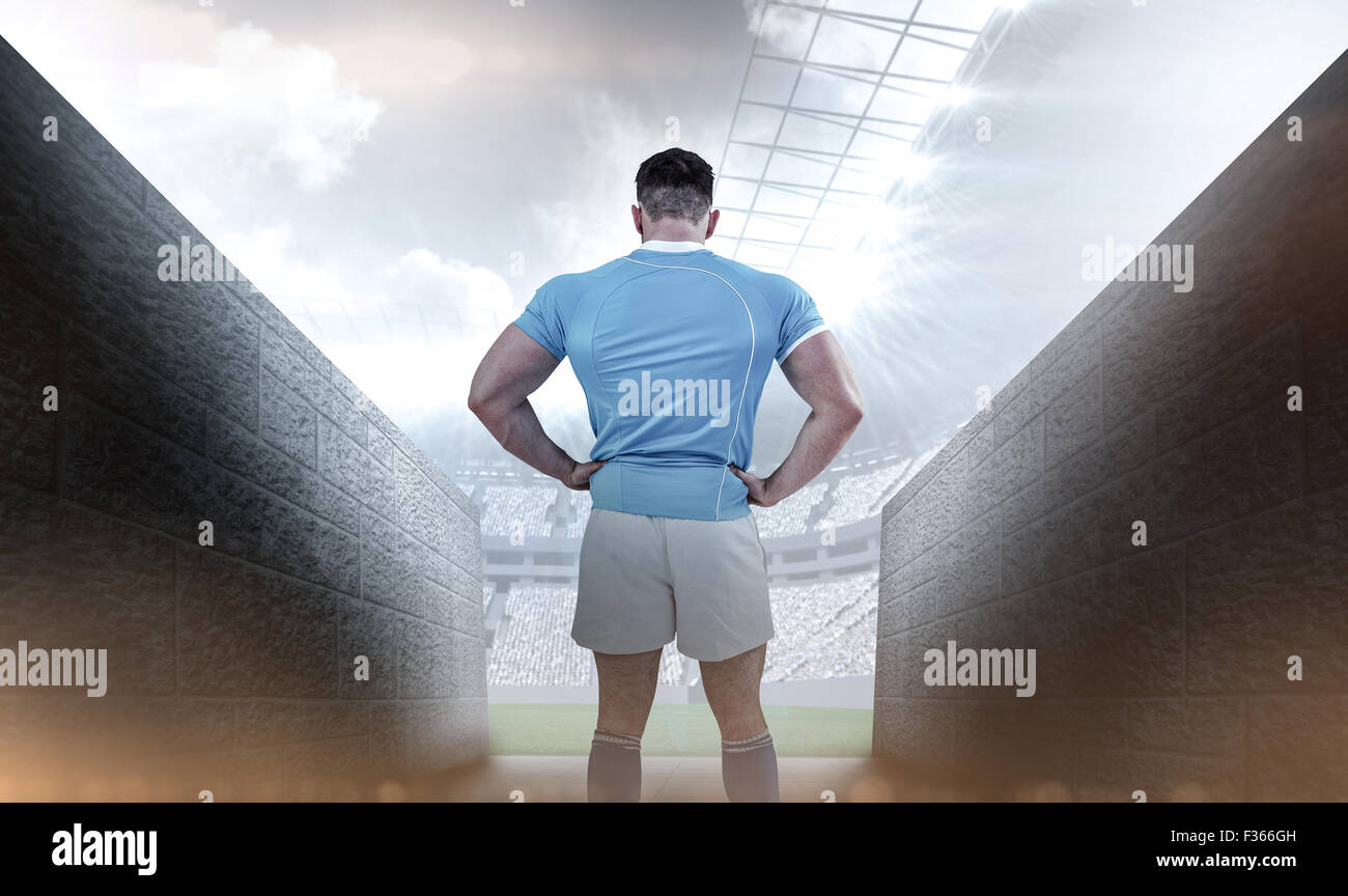 Composite image of rugby player with hands on hips Stock Photo - Alamy