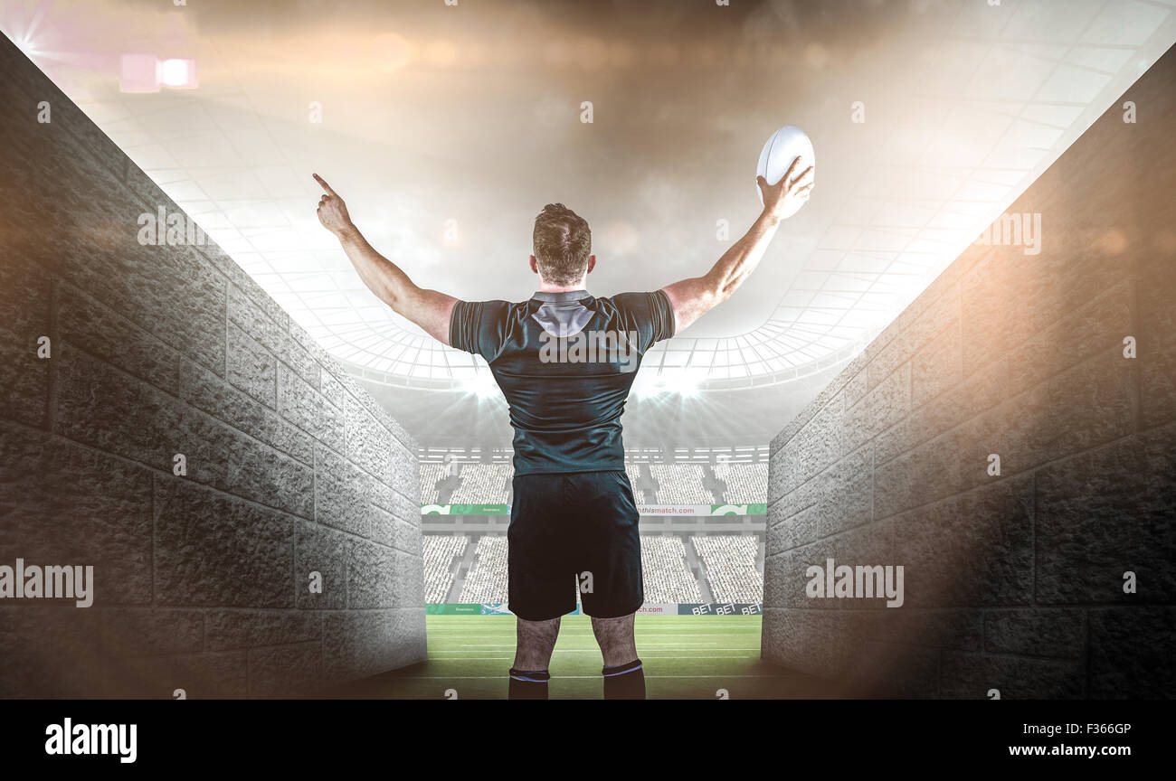 Composite image of rugby player celebrating with the ball Stock Photo ...