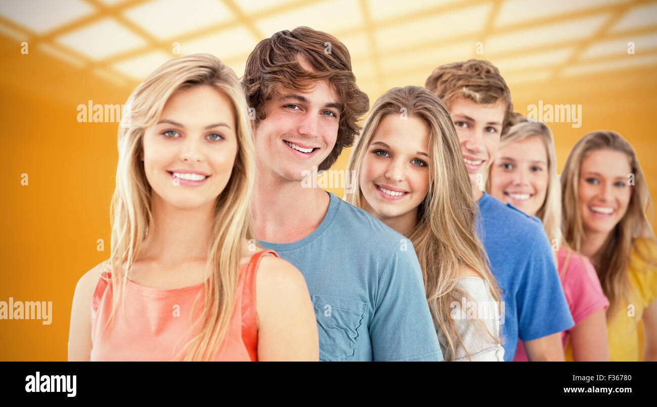 Composite image of a smiling group standing behind each other Stock ...