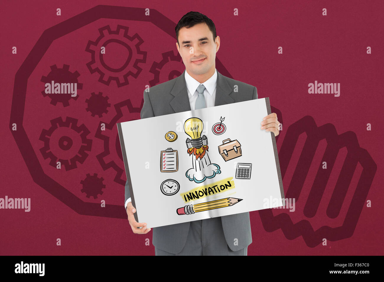 Composite image of businessman showing a book Stock Photo - Alamy