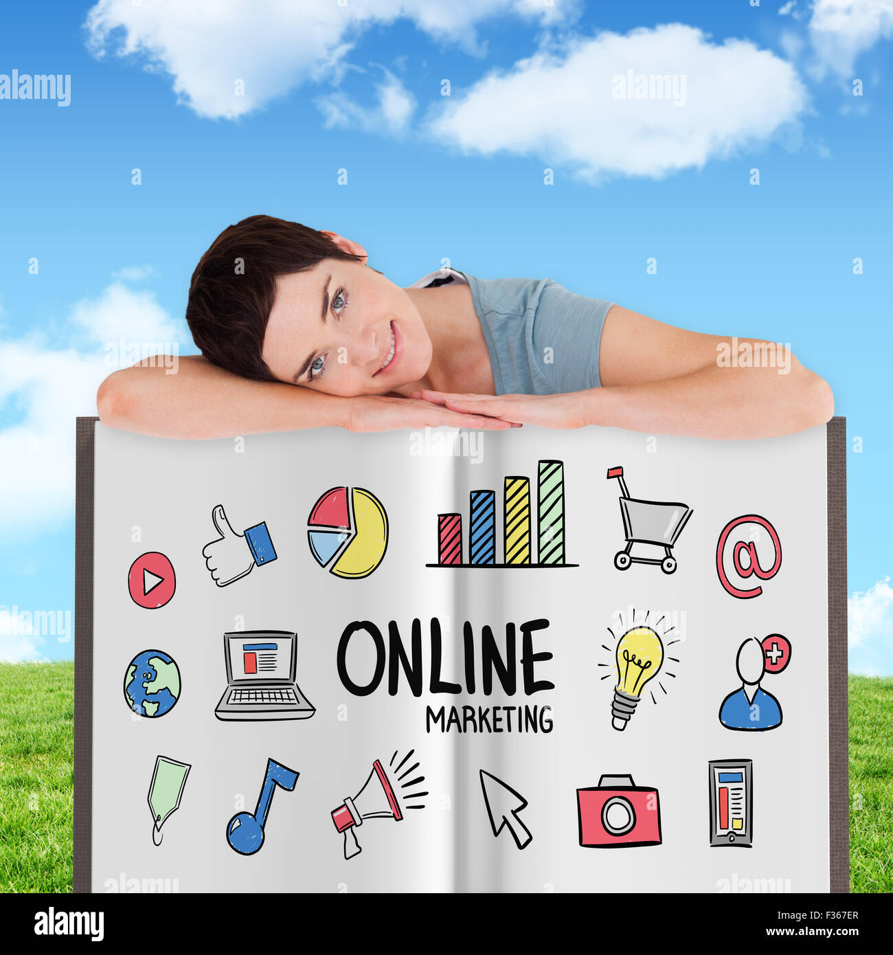 Composite image of woman showing a book Stock Photo - Alamy