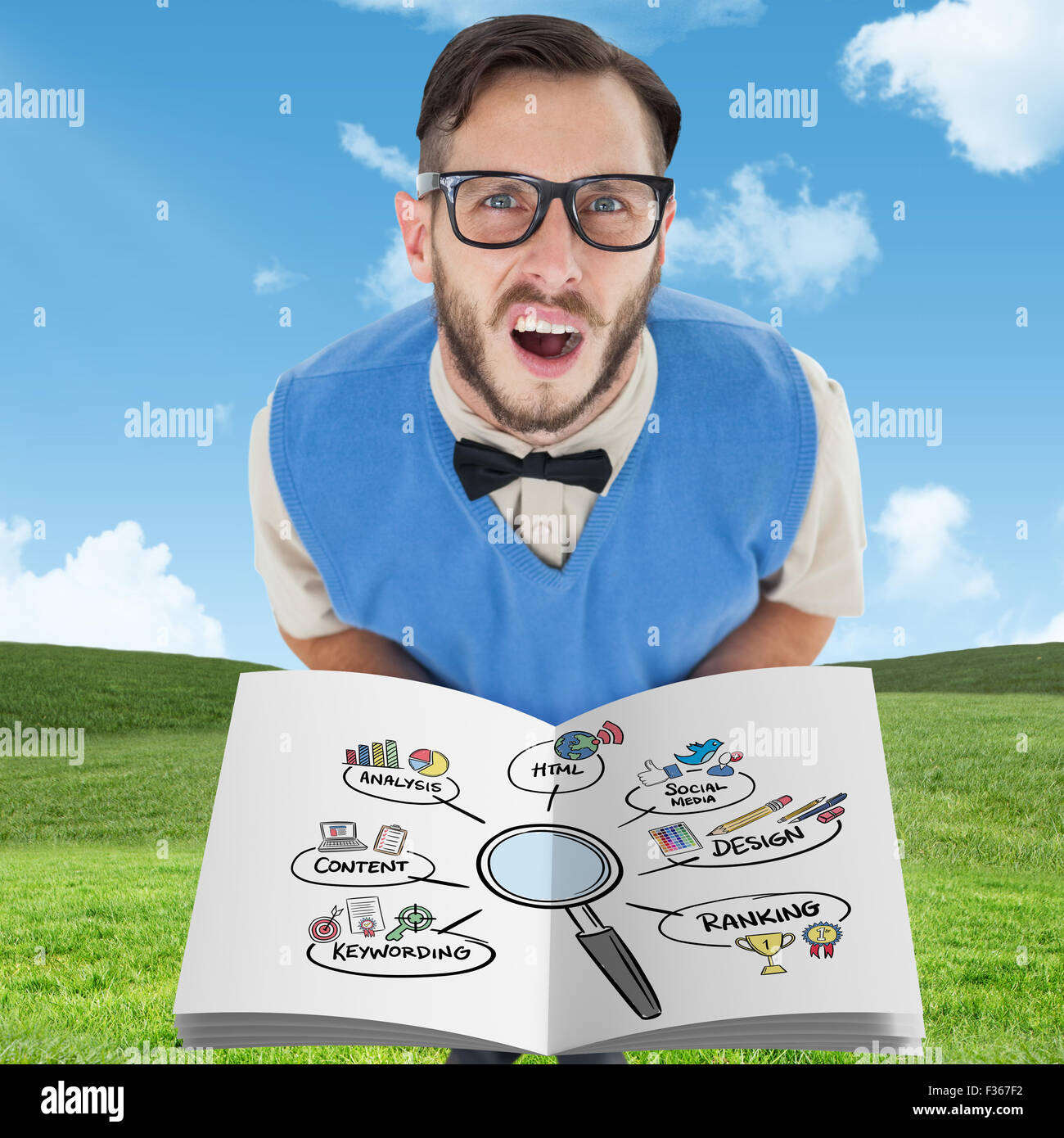 Composite image of nerd showing a book Stock Photo - Alamy