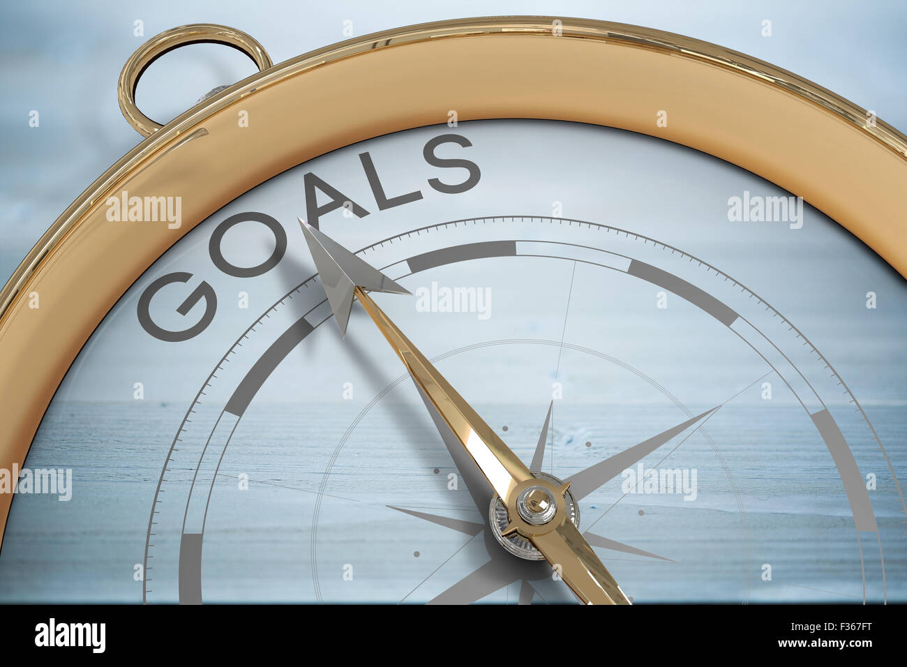 Composite image of compass pointing to goals Stock Photo - Alamy