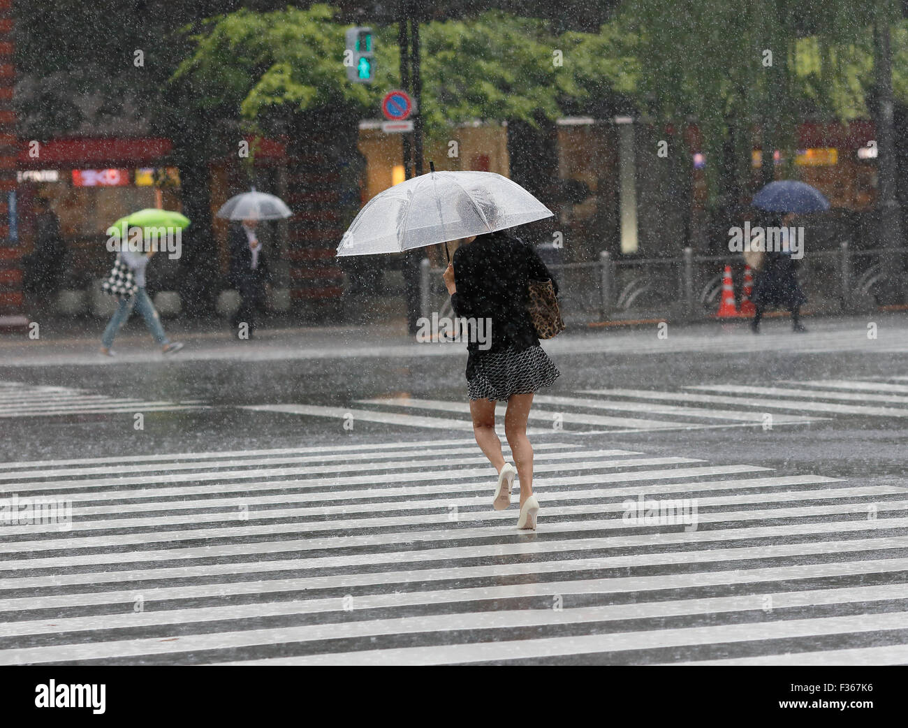 Tokyo Street in rain Stock Photo - Alamy