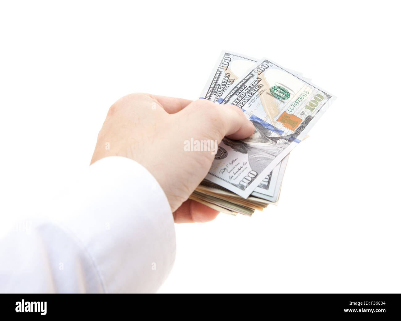 Handing out pile of dollar notes. All on white background Stock Photo ...