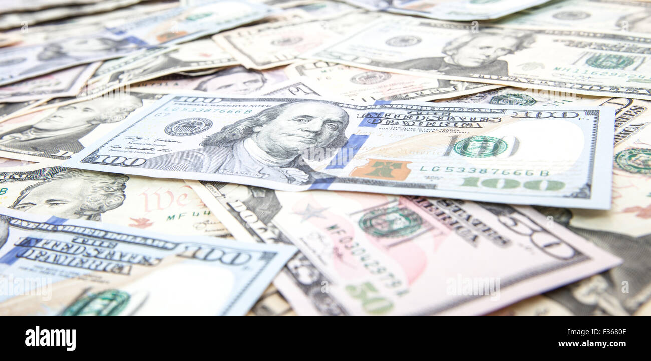 Various dollar notes background concept Stock Photo - Alamy