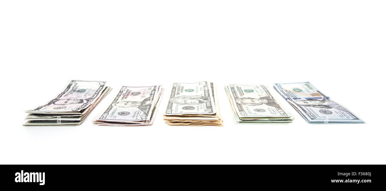 Piles of various dollar notes. All on white background Stock Photo - Alamy
