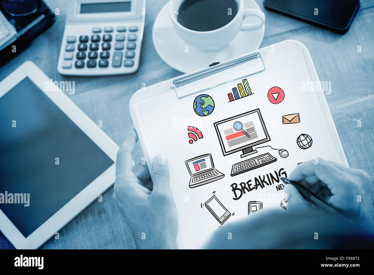 Composite image of man writing on clipboard on working desk Stock Photo ...