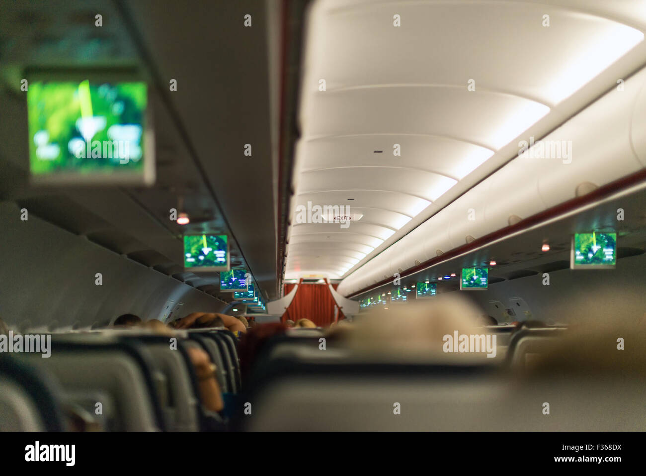 Interior inside of the plane with passengers Stock Photo - Alamy