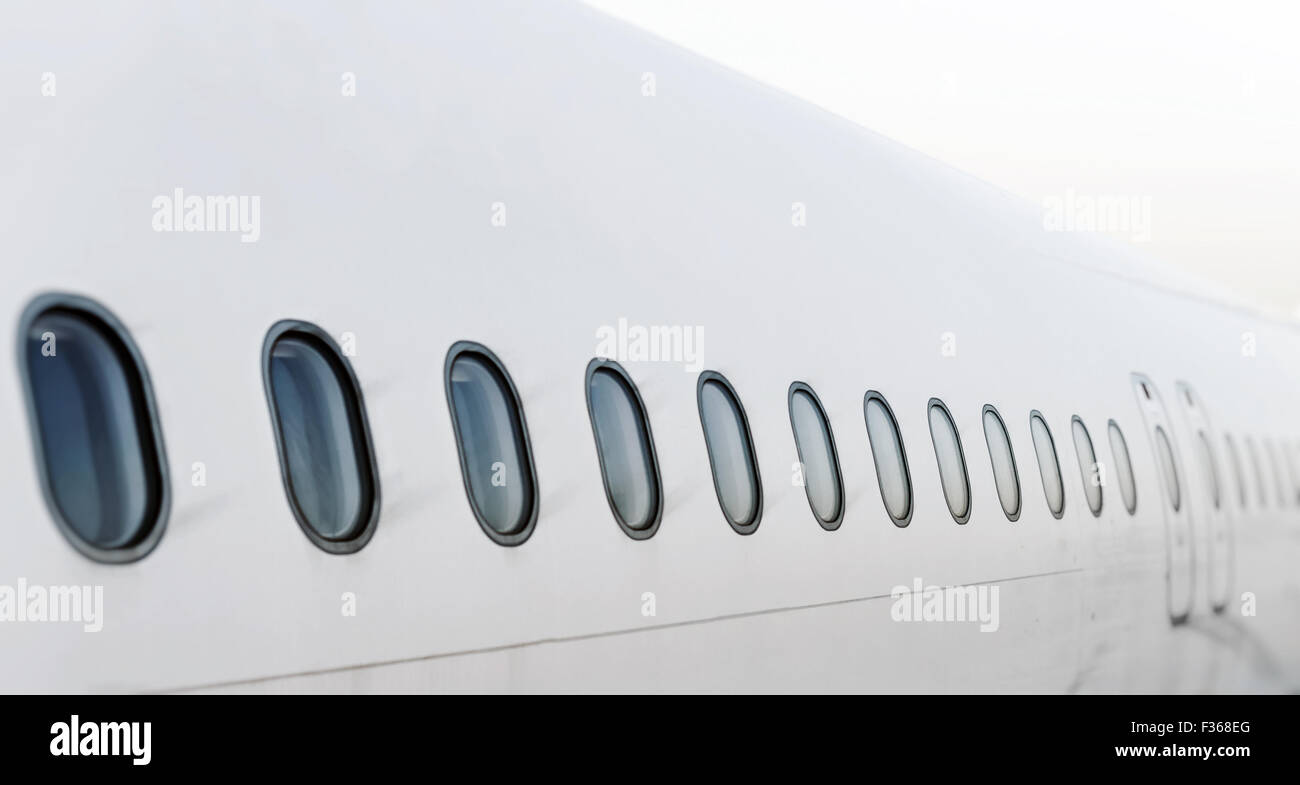 Passenger aircraft windows. View from outside Stock Photo - Alamy