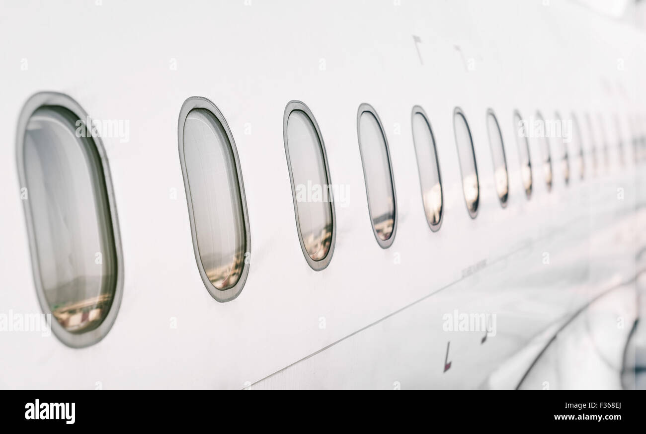 Passenger aircraft windows. View from outside Stock Photo - Alamy