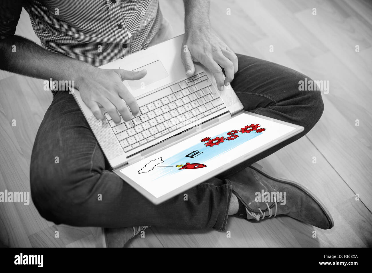 Composite image of cog and wheel rocket graphic Stock Photo - Alamy