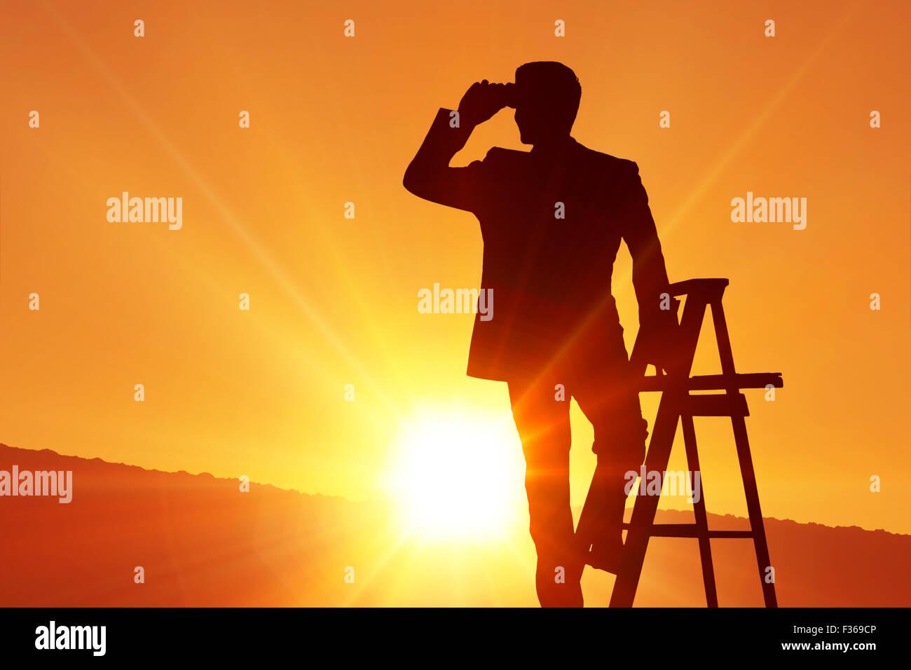 Composite image of silhouette standing on ladder Stock Photo - Alamy