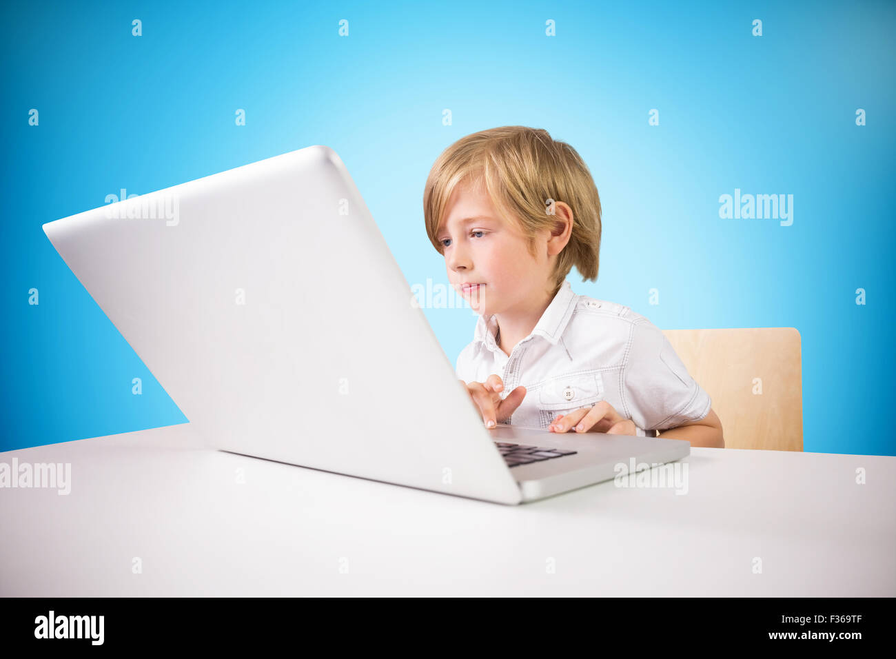Boy using laptop computer hi-res stock photography and images - Alamy