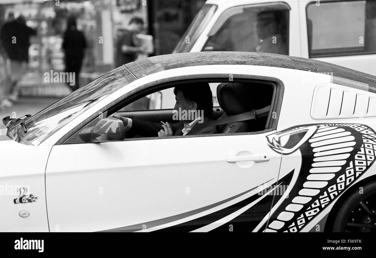 Japan man in sports car Stock Photo - Alamy