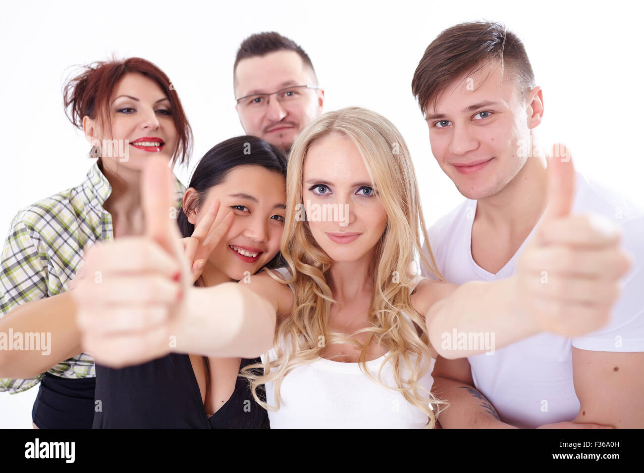 a group of students waving their hands Stock Photo - Alamy