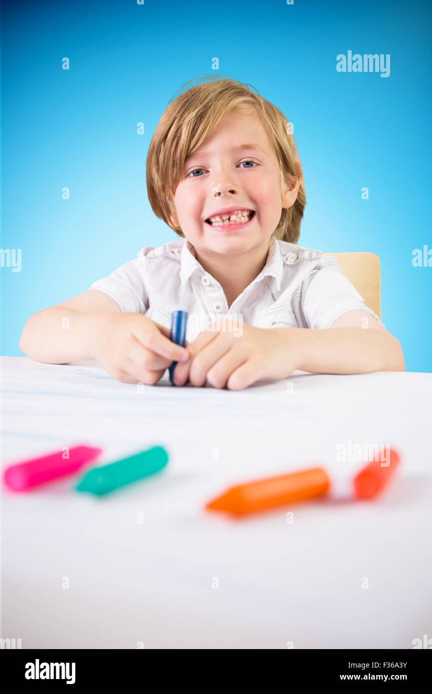 Composite image of cute boy colouring Stock Photo - Alamy