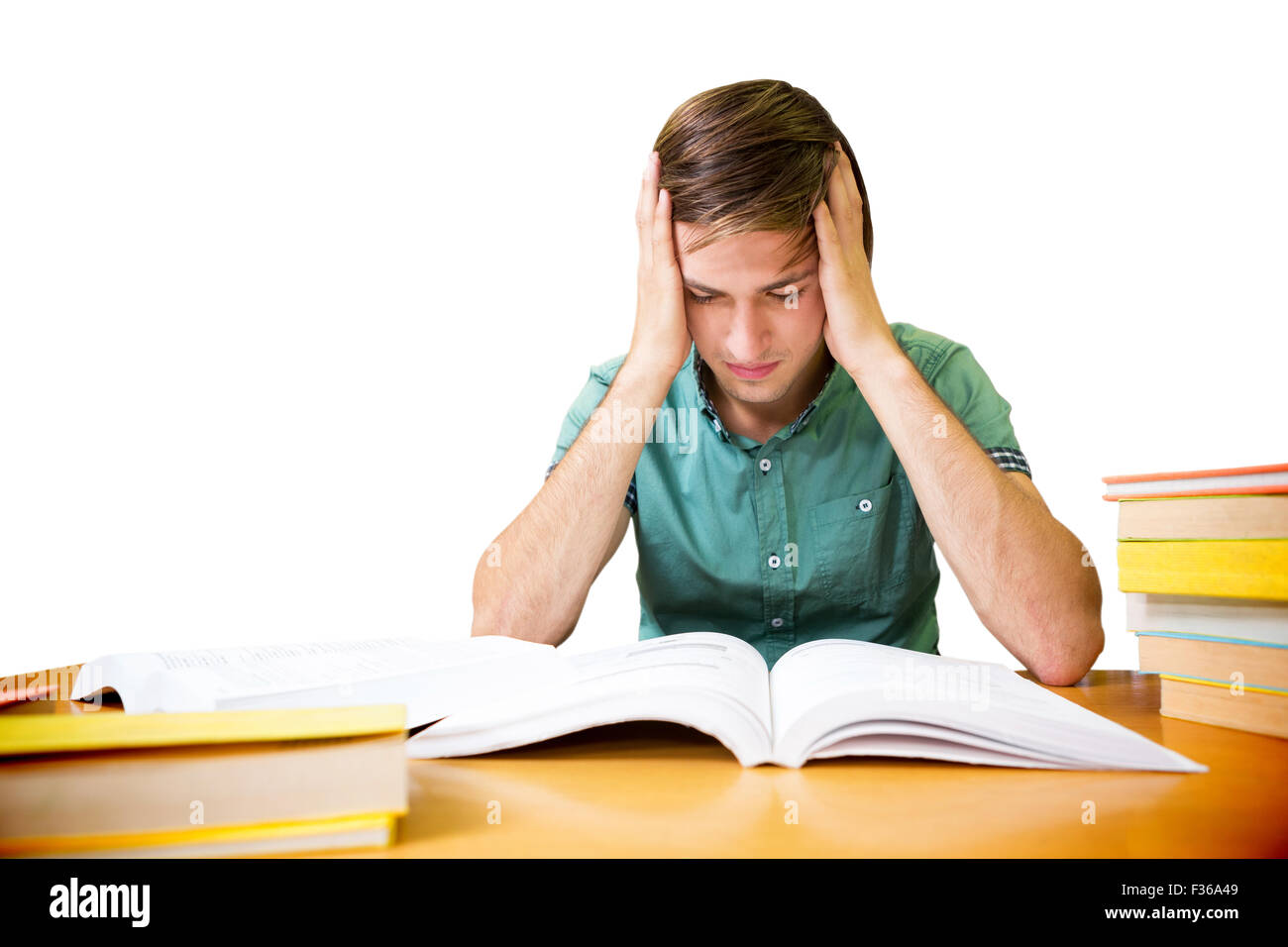 Student sitting in library reading Stock Photo - Alamy