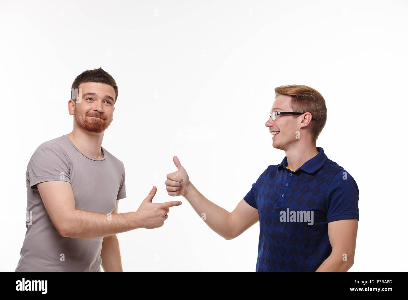 Two young men having fun talking Stock Photo - Alamy