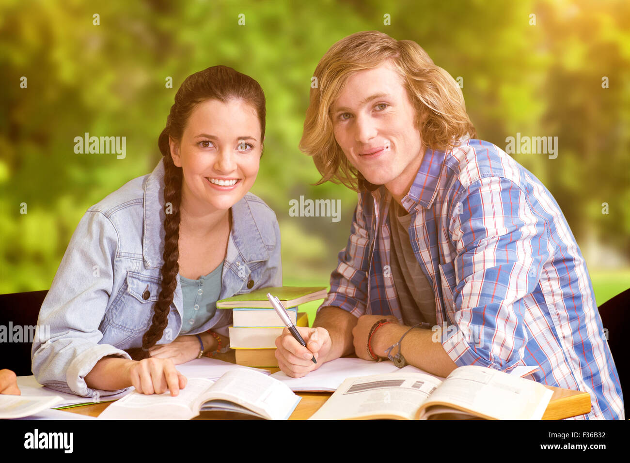 Composite image of college students doing homework in library Stock ...