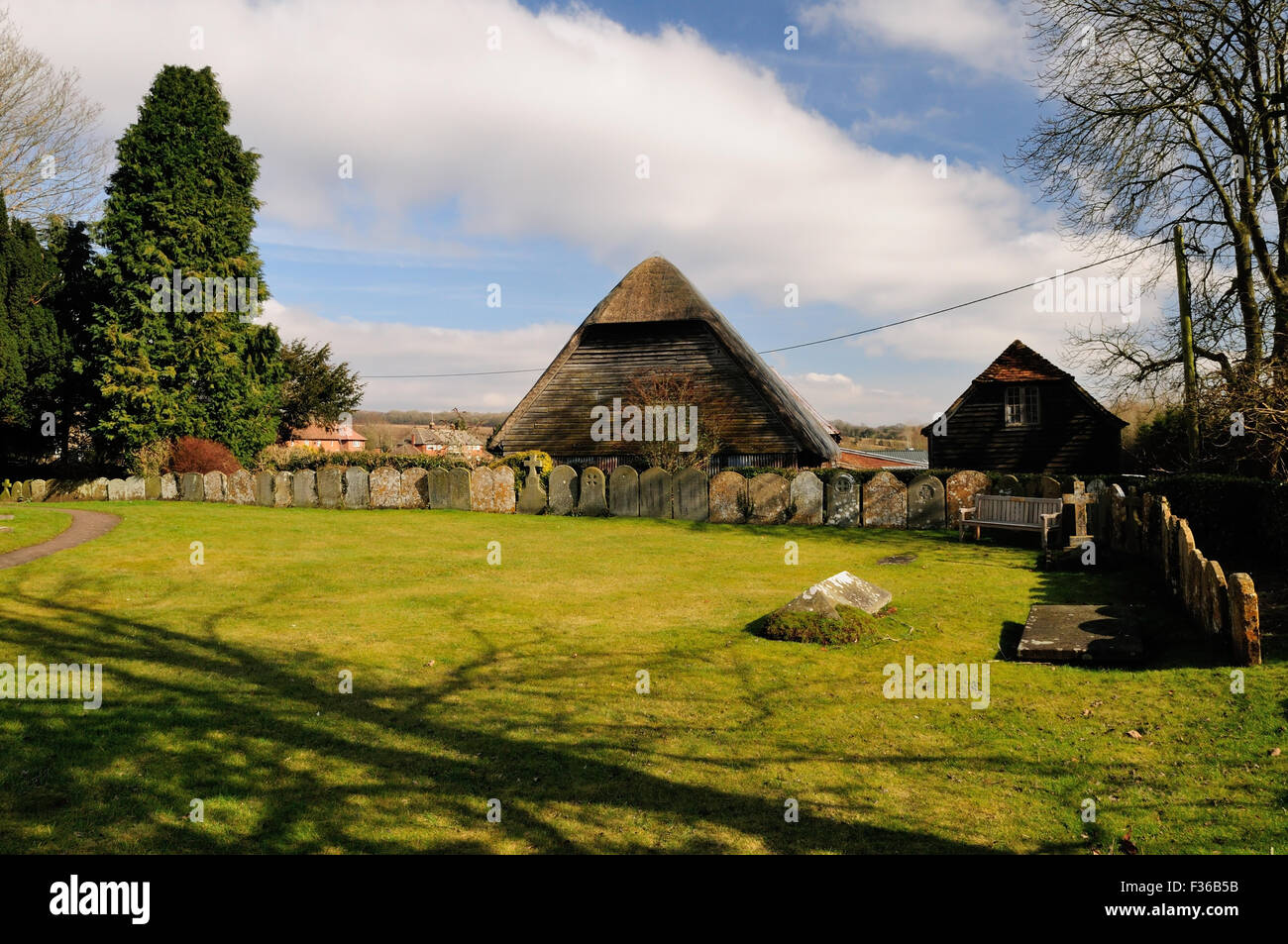 Headstones arranged around the perimeter of the graveyard at St John ...