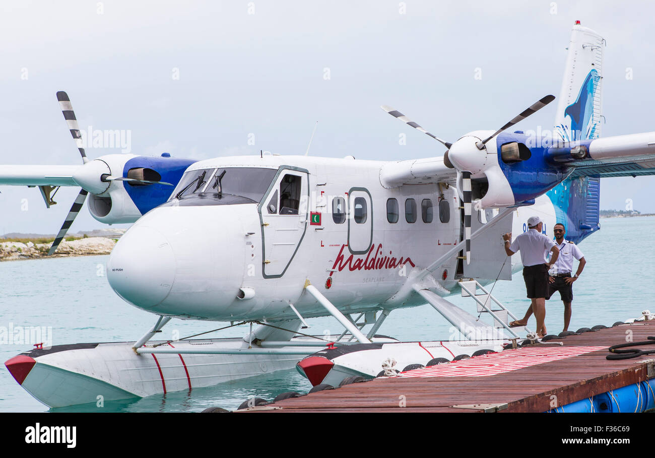 Maldivian Seaplane with two pilots talking whilst docked at the Niyama ...