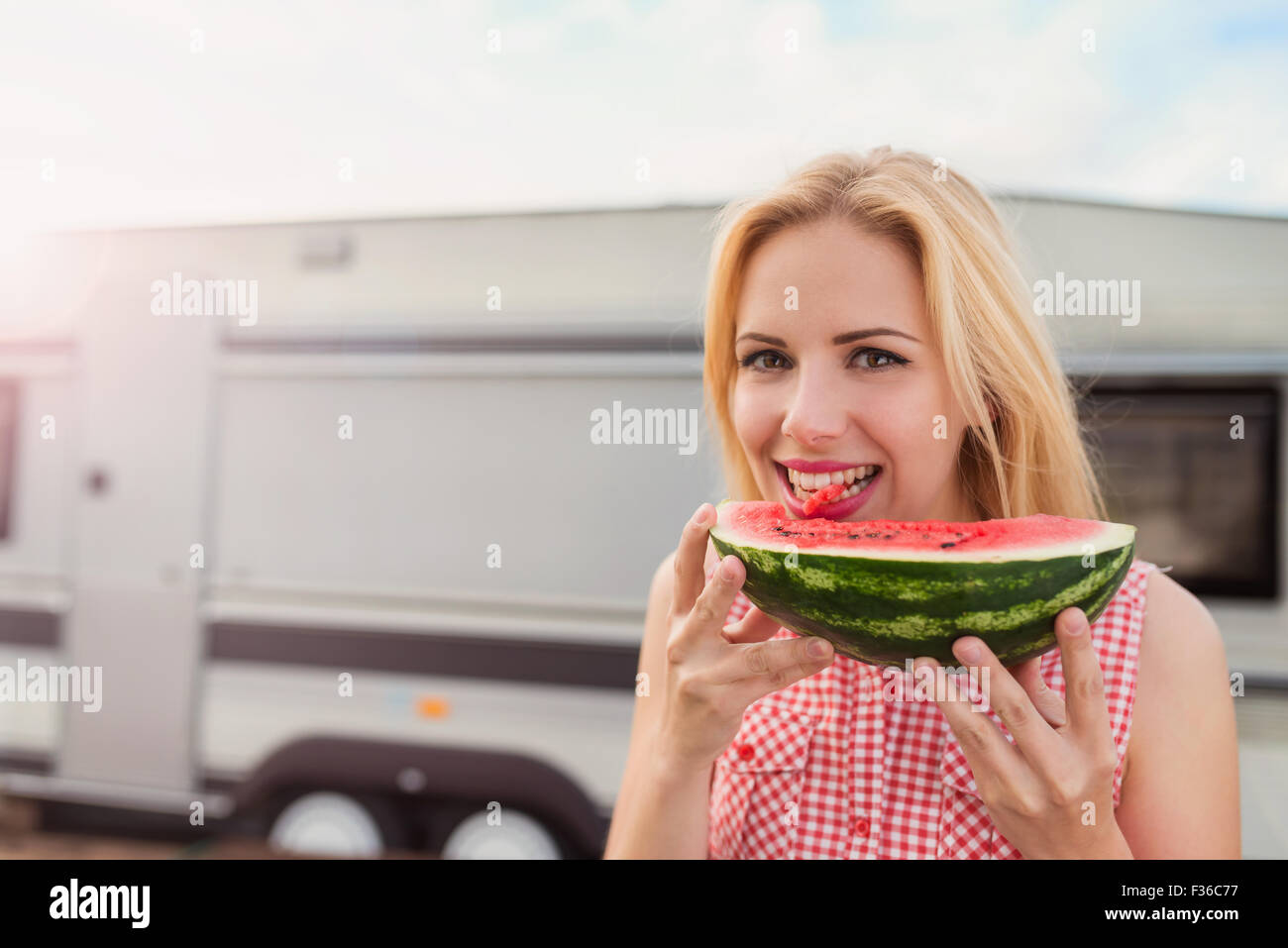 Beautiful woman outside the camper van Stock Photo - Alamy