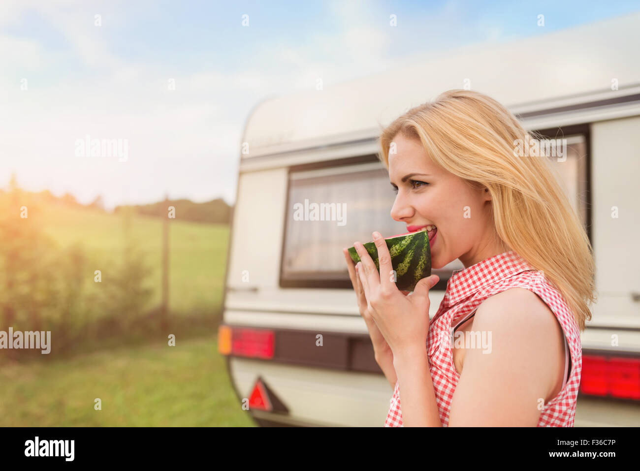 Beautiful woman outside the camper van Stock Photo - Alamy