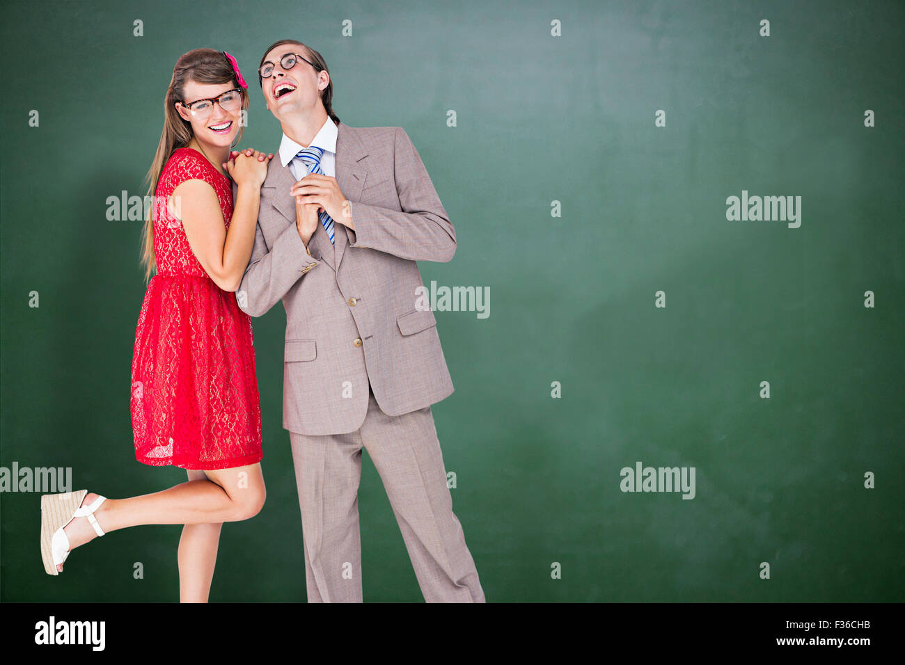 Composite image of hipster couple having fun together Stock Photo - Alamy
