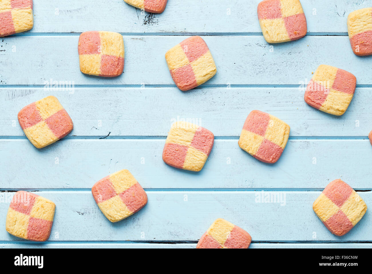 colored butter biscuits on blue table Stock Photo - Alamy