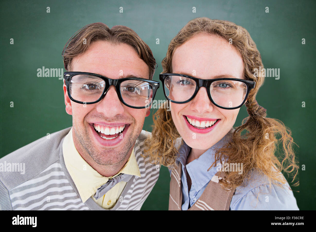 Composite image of happy geeky hipster smiling at camera Stock Photo ...