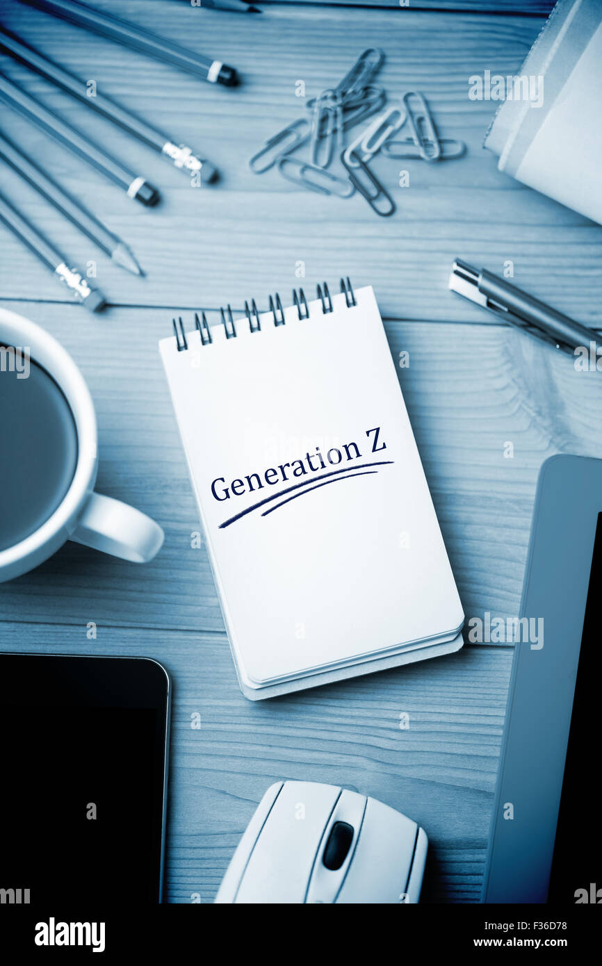 Generation z against notepad on desk Stock Photo - Alamy
