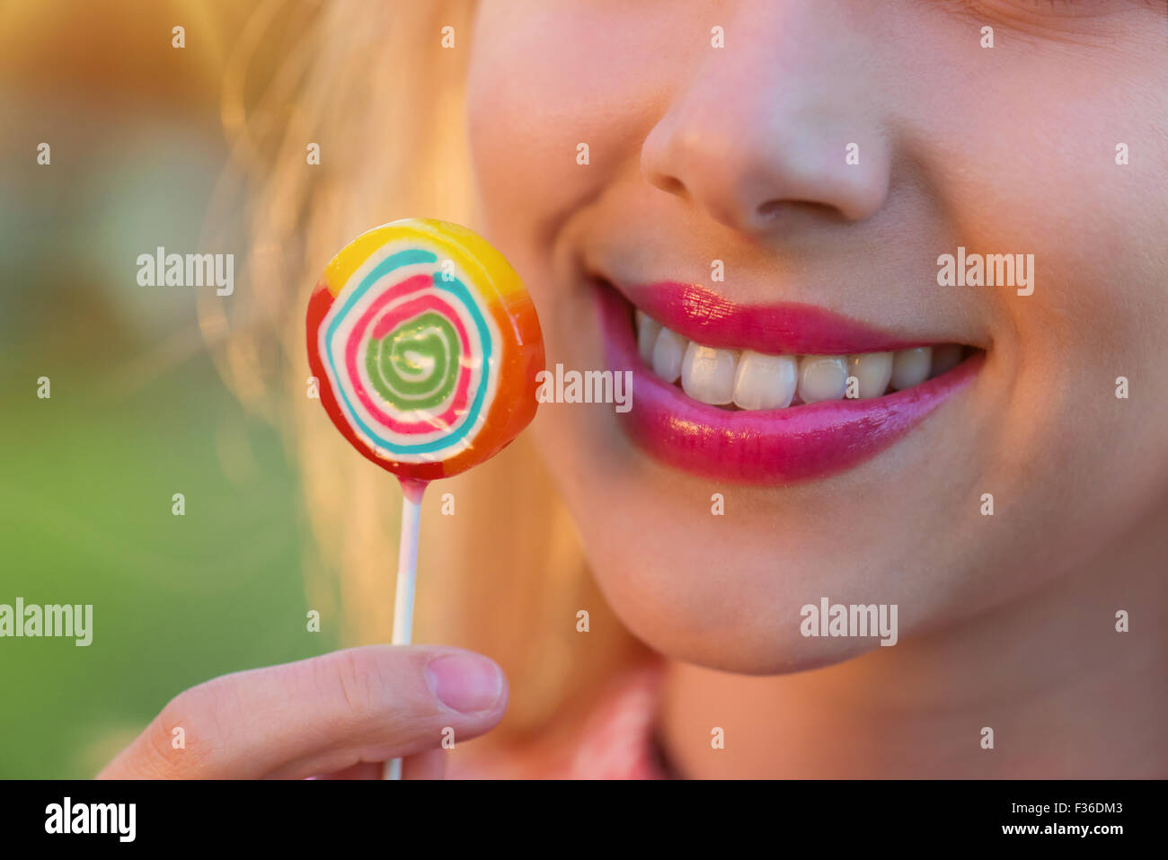 Beautiful woman with lollipop Stock Photo - Alamy